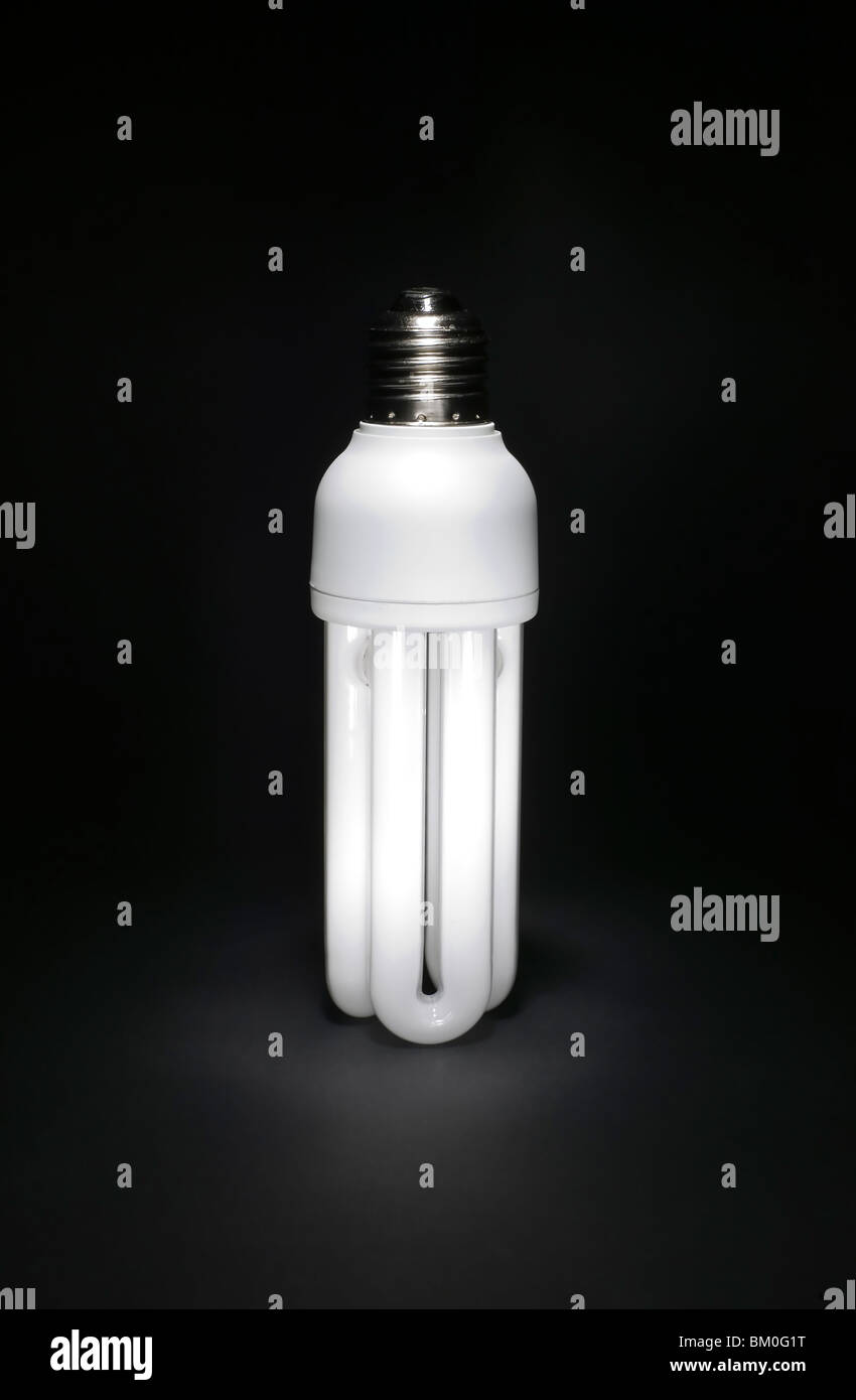Electric bulb on black background with white light Stock Photo - Alamy