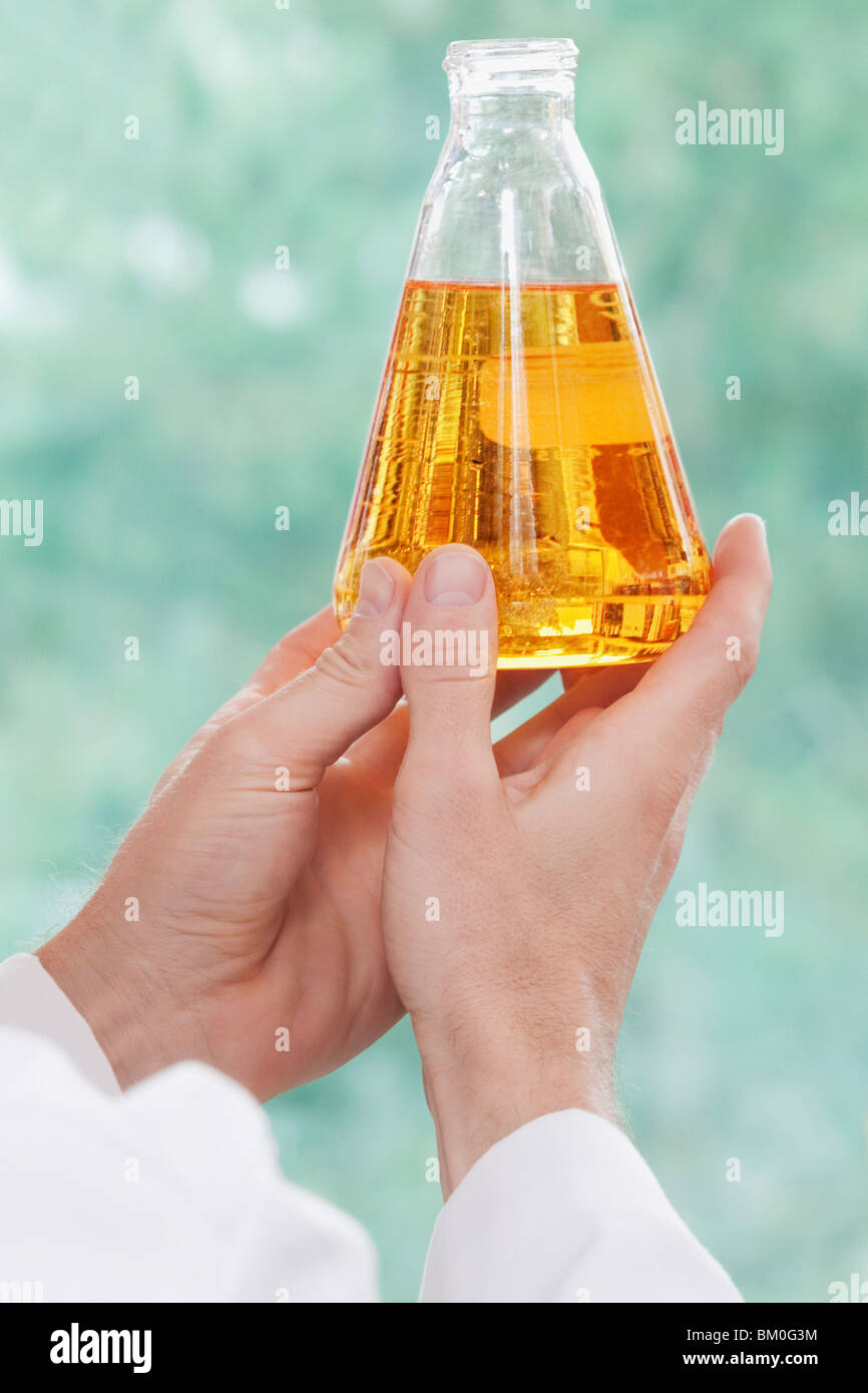 Doctor holding a conical flask in a laboratory Stock Photo - Alamy