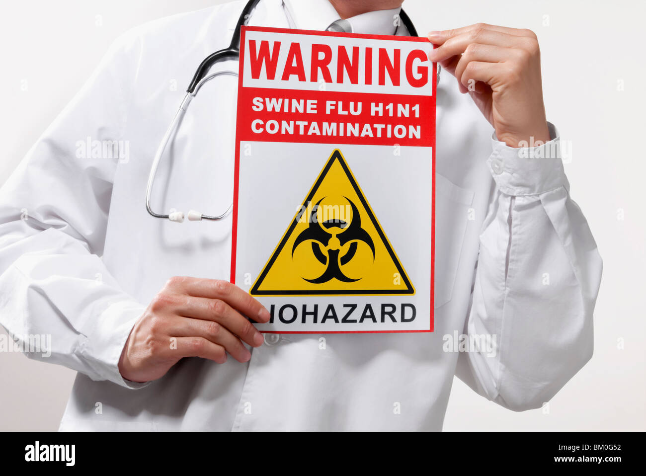Doctor showing a Biohazard warning sign Stock Photo - Alamy
