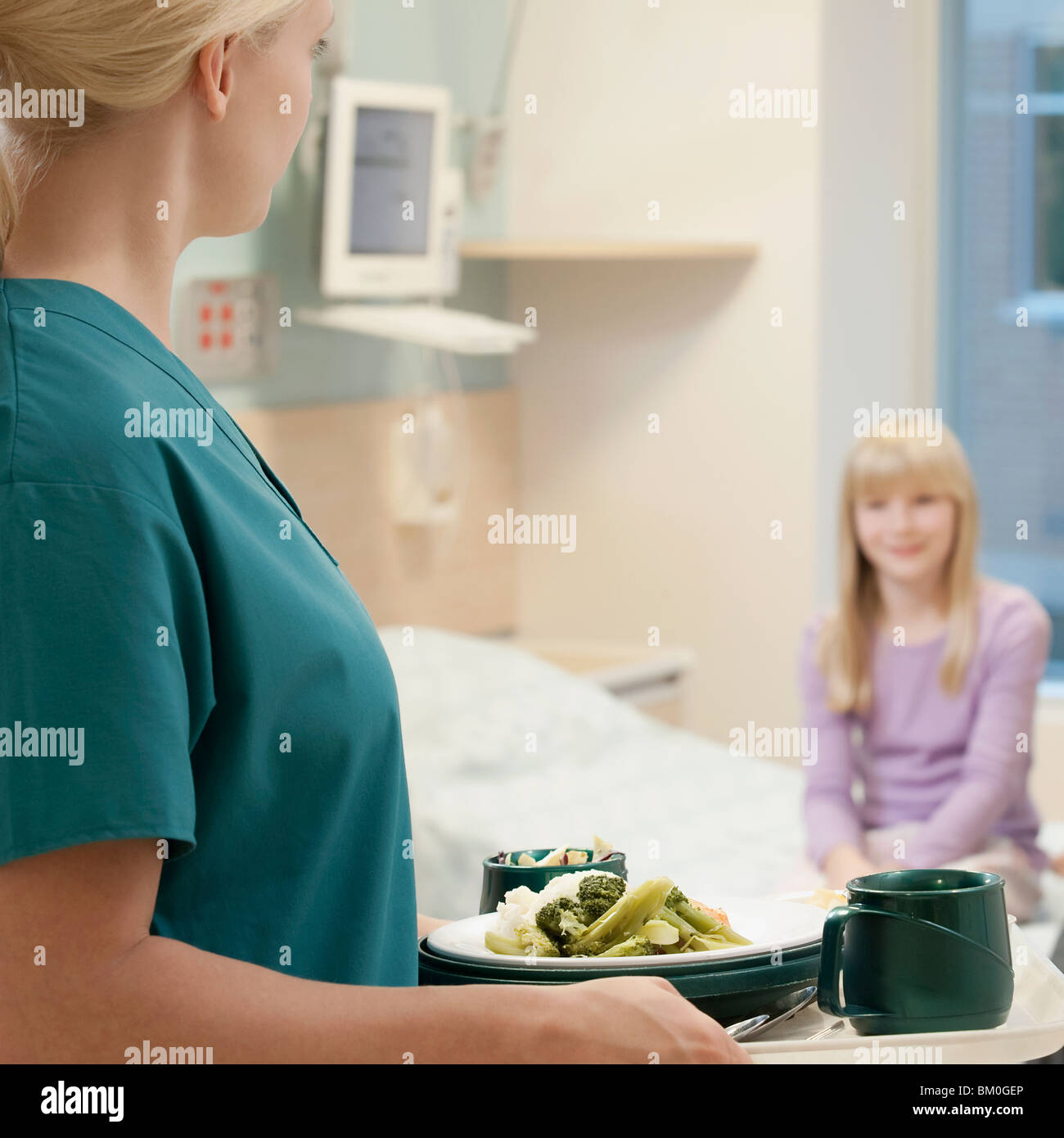 Female nurse serving food patient hi-res stock photography and images ...