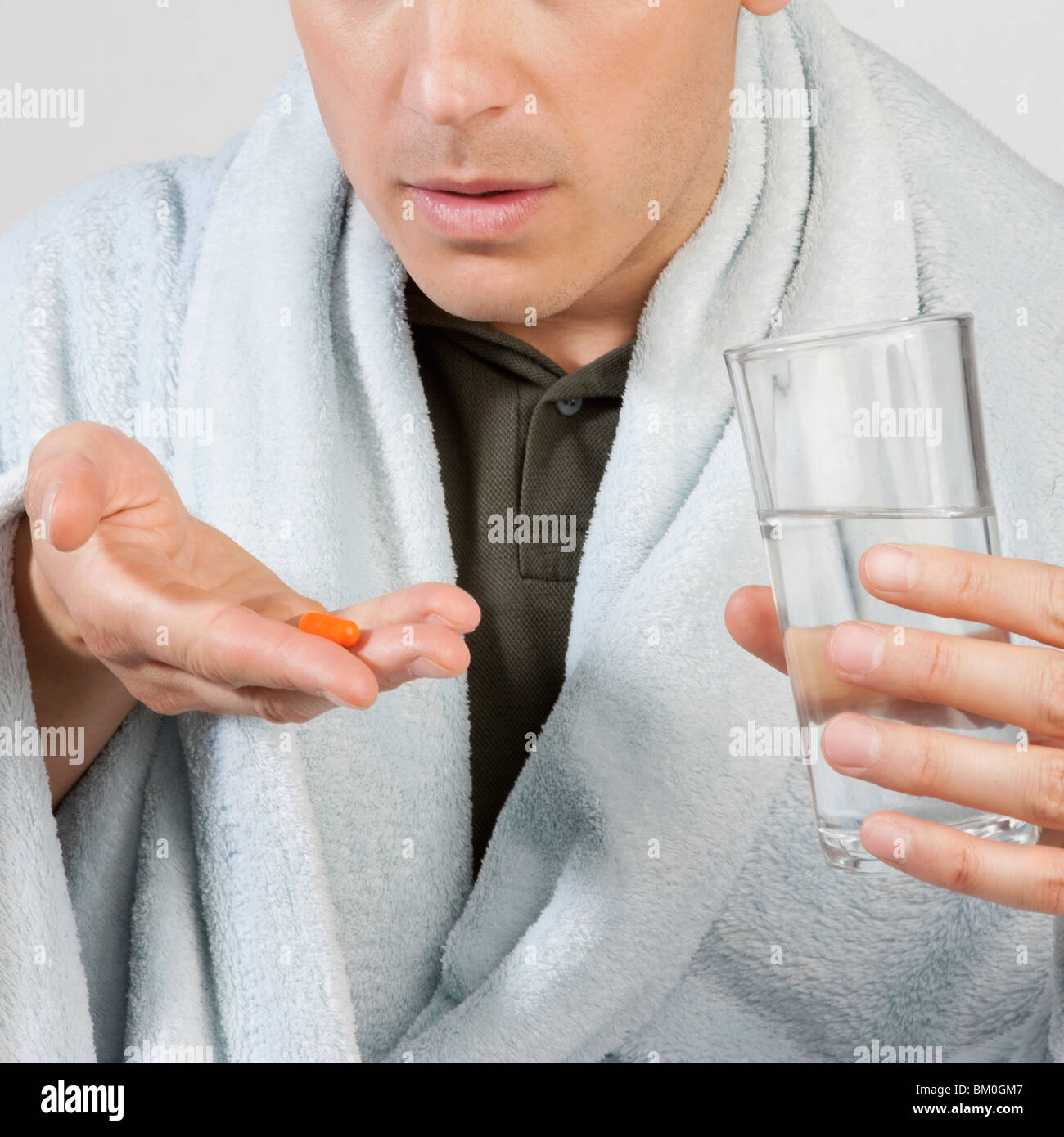 Man taking medicine Stock Photo - Alamy