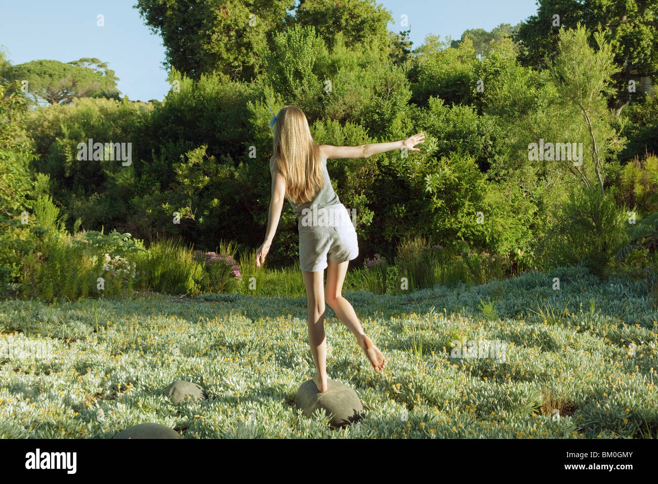 Woman balancing rear view hi-res stock photography and images - Alamy