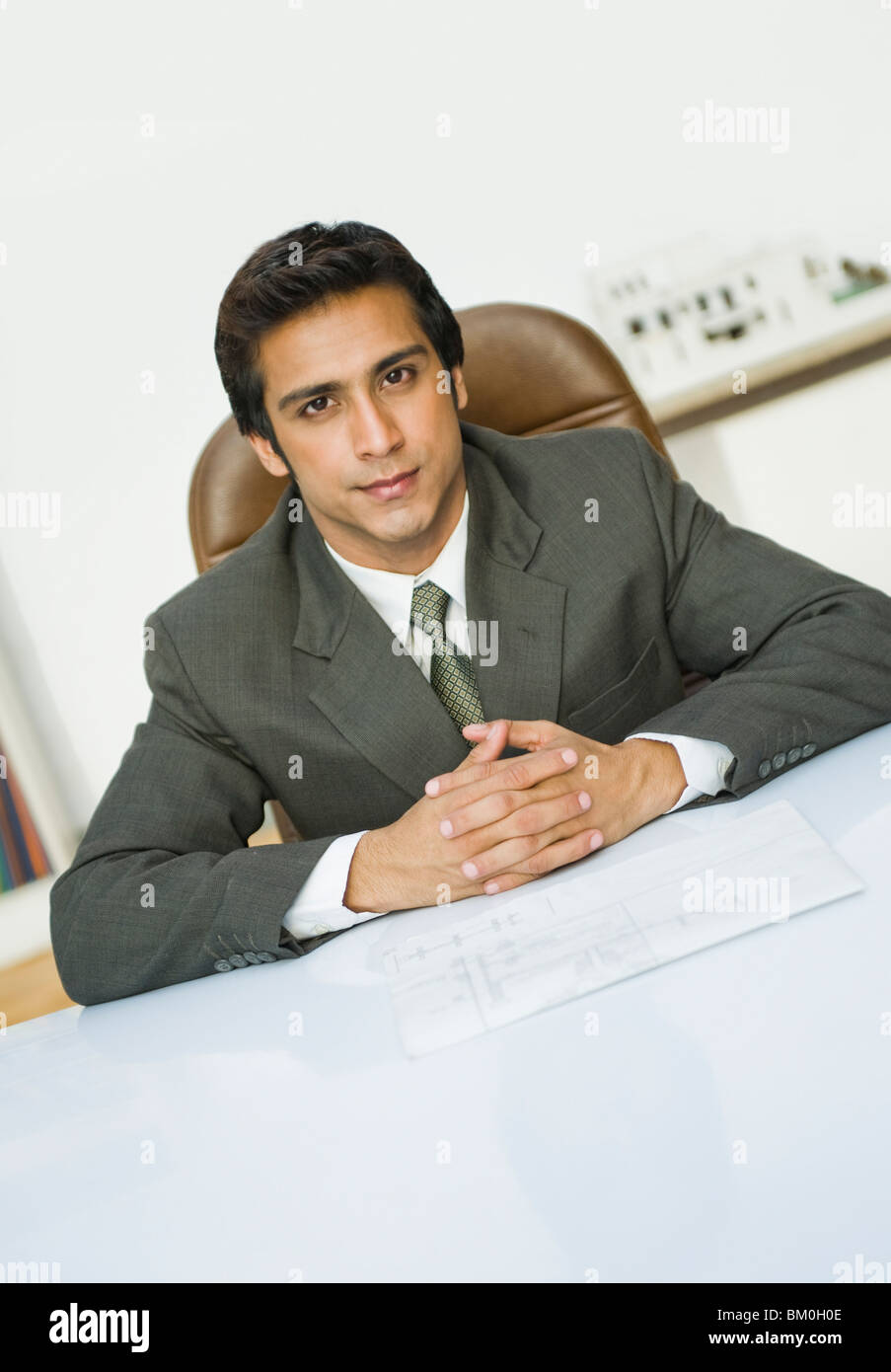 Portrait of a businessman with a blueprint in an office Stock Photo - Alamy