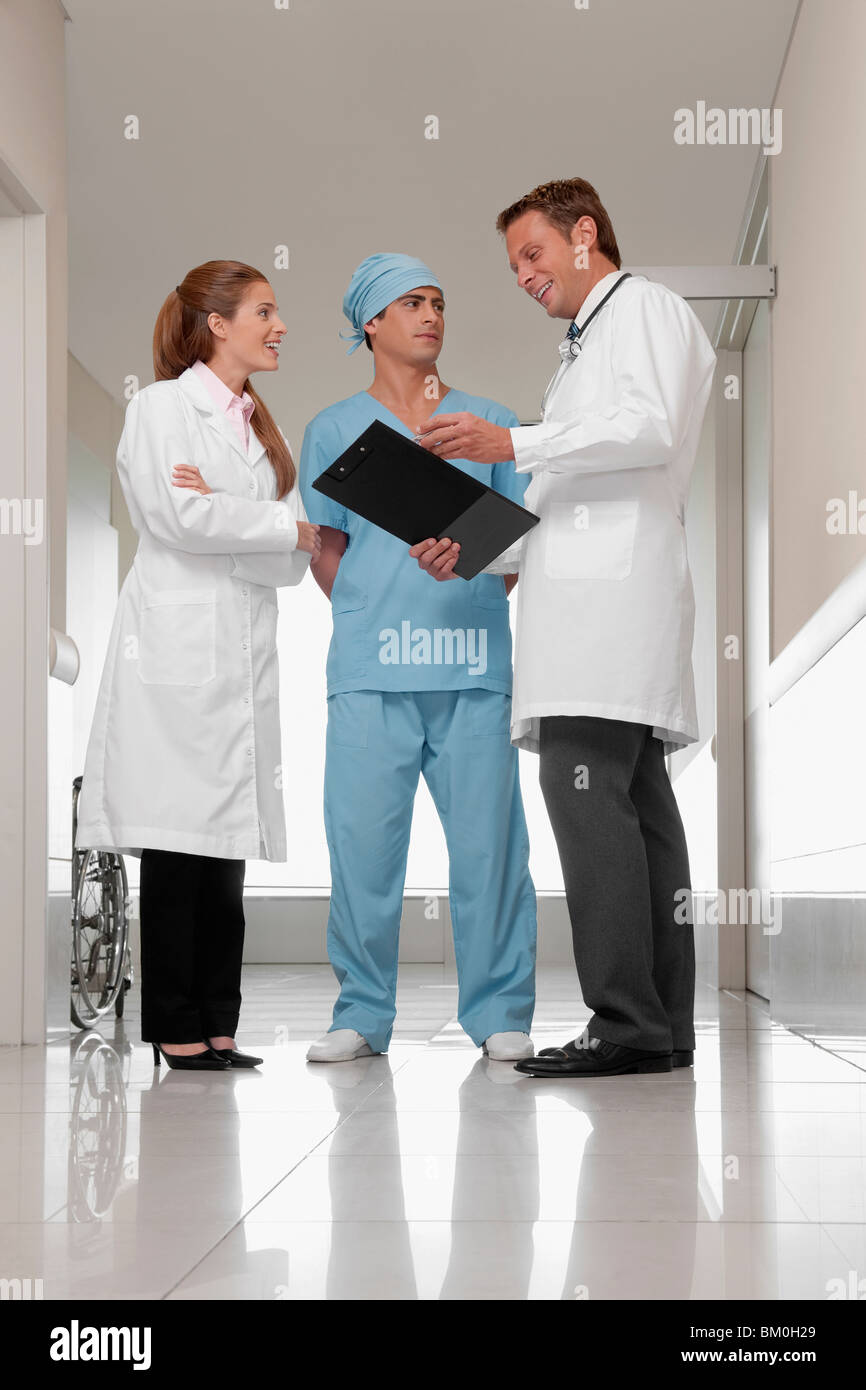 Three doctors discussing in a hospital Stock Photo - Alamy