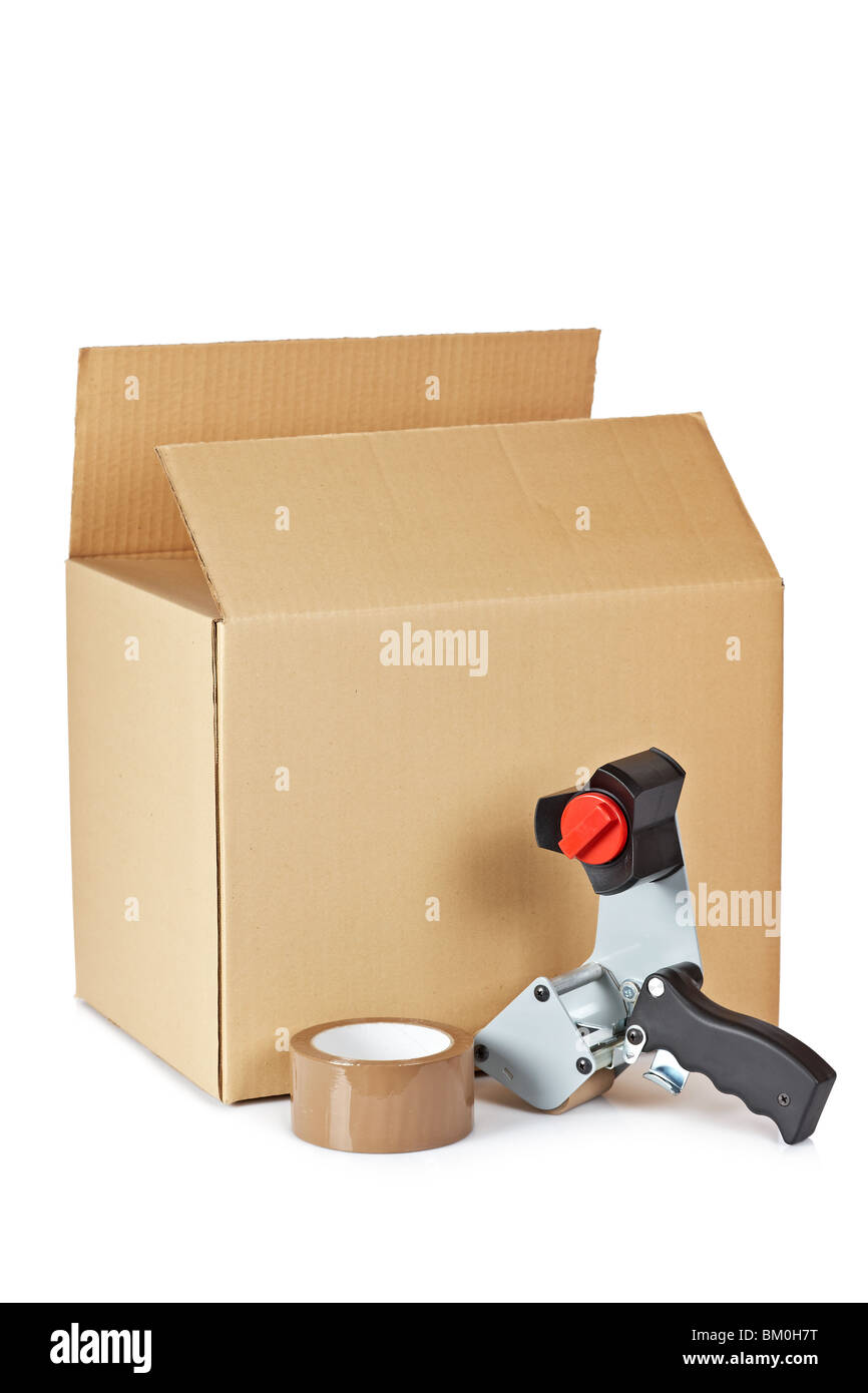 Packaging tape dispenser and shipping box isolated on white background ...