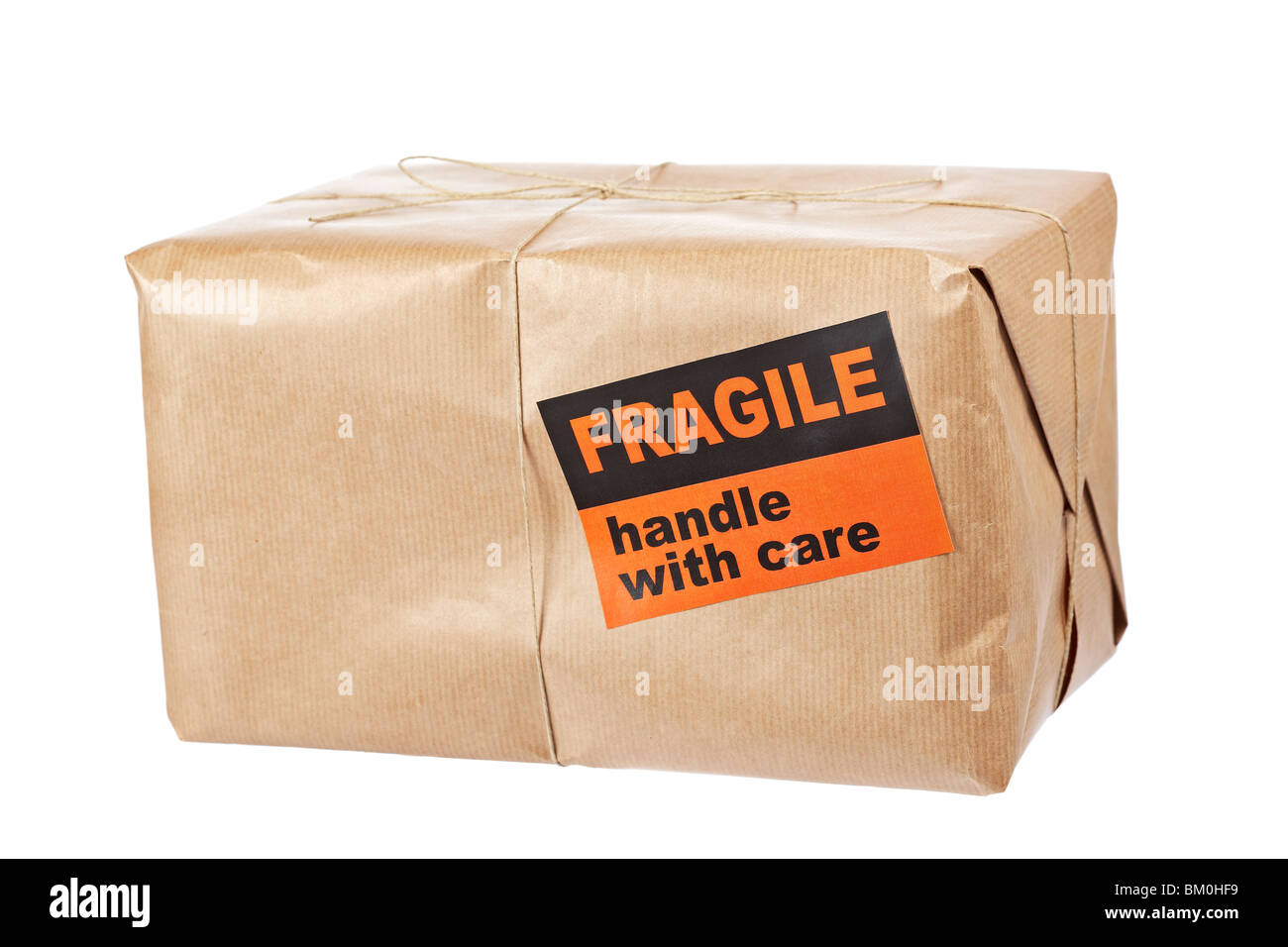 A fragile parcel wrapped in brown paper and tied with rough twine ...