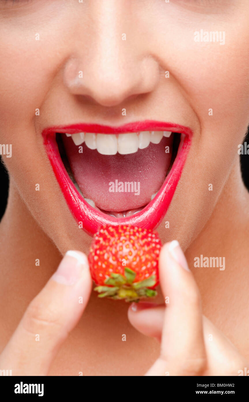 Person putting food in mouth hi-res stock photography and images - Alamy