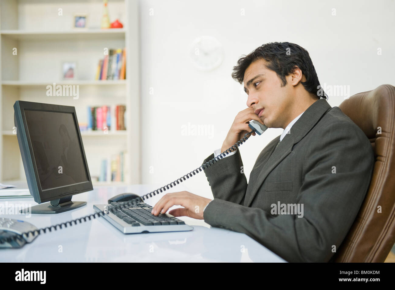 Sitting place of work communication landline phone technology working ...