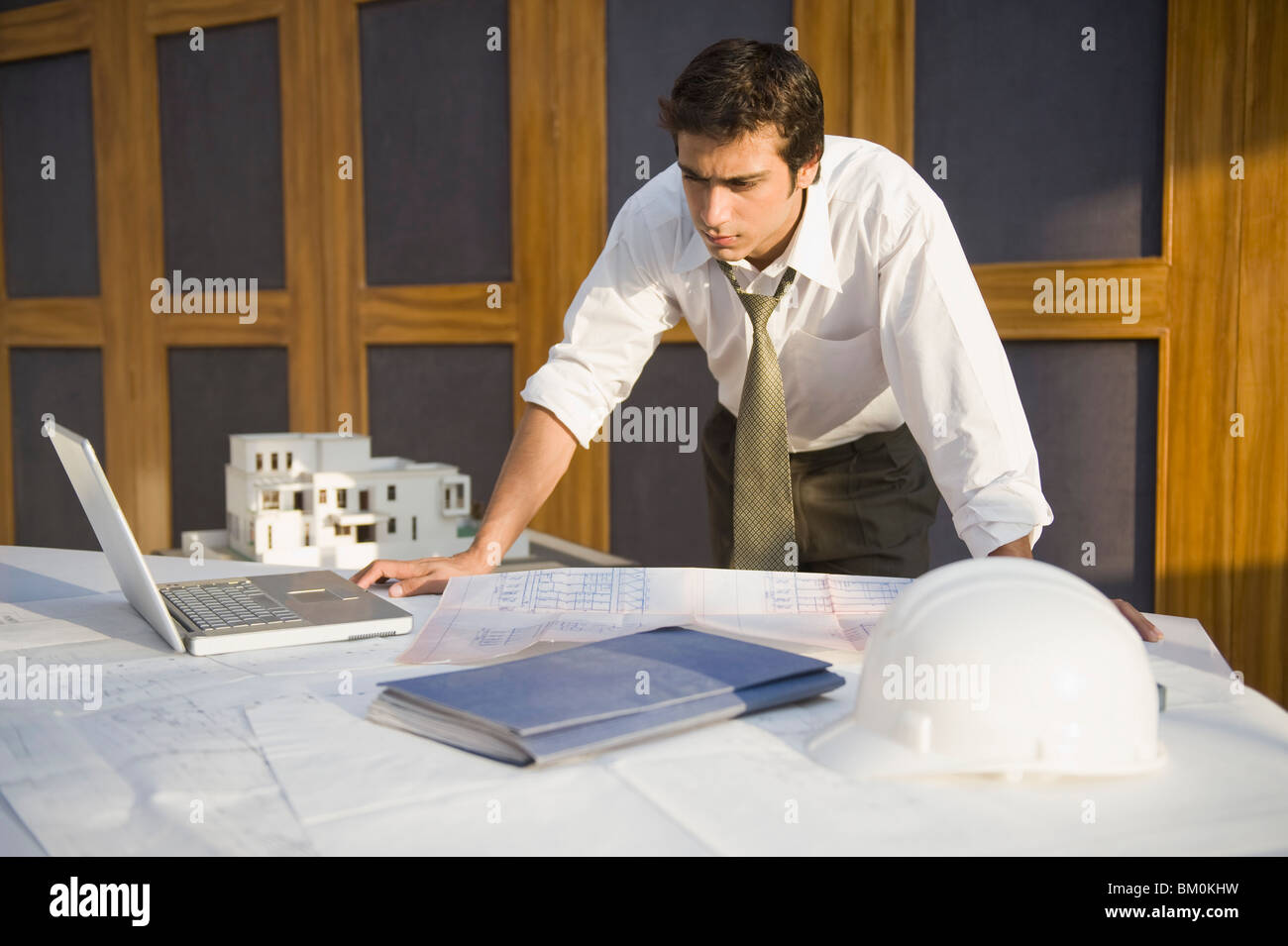 Architect working on a blueprint Stock Photo - Alamy
