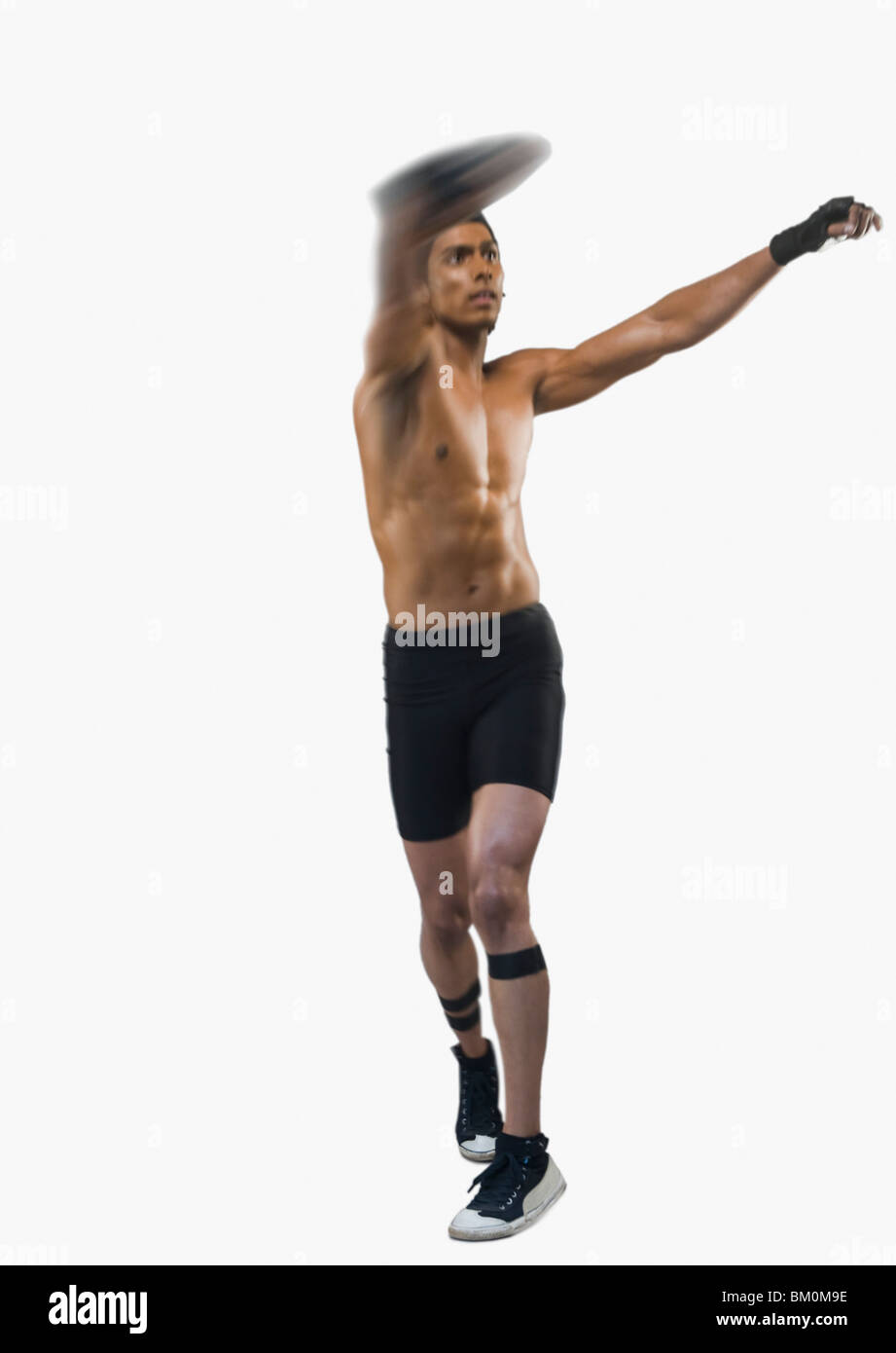Athlete throwing a discuss Stock Photo - Alamy