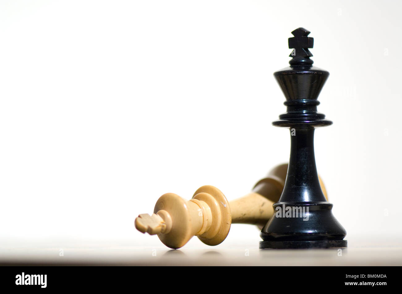 Chess. Black King victorious on chess board Stock Photo - Alamy