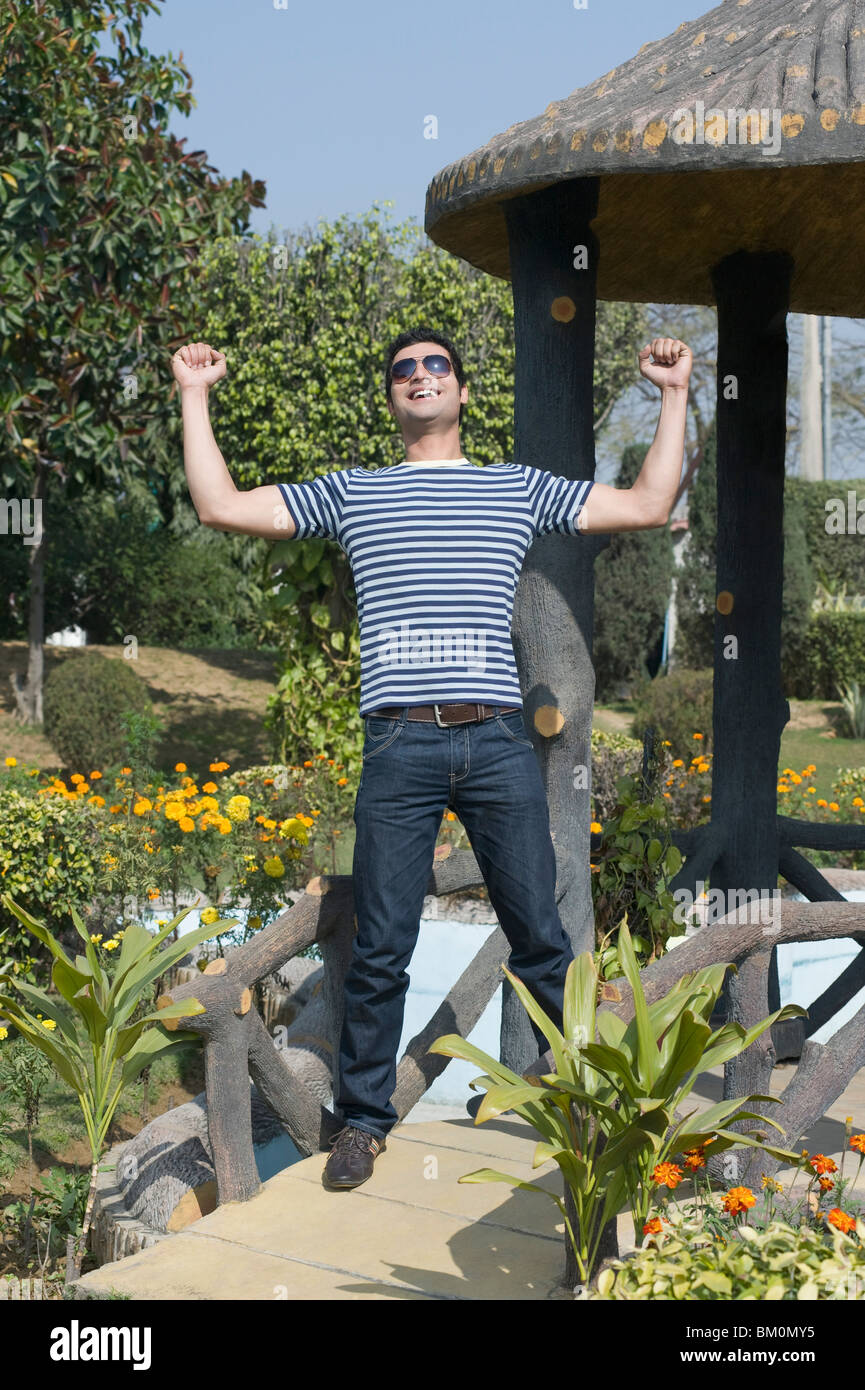 Man standing in a garden Stock Photo - Alamy