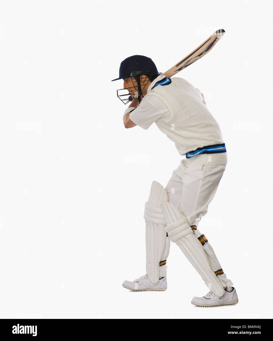 Indian man holding cricket bat Cut Out Stock Images & Pictures - Alamy