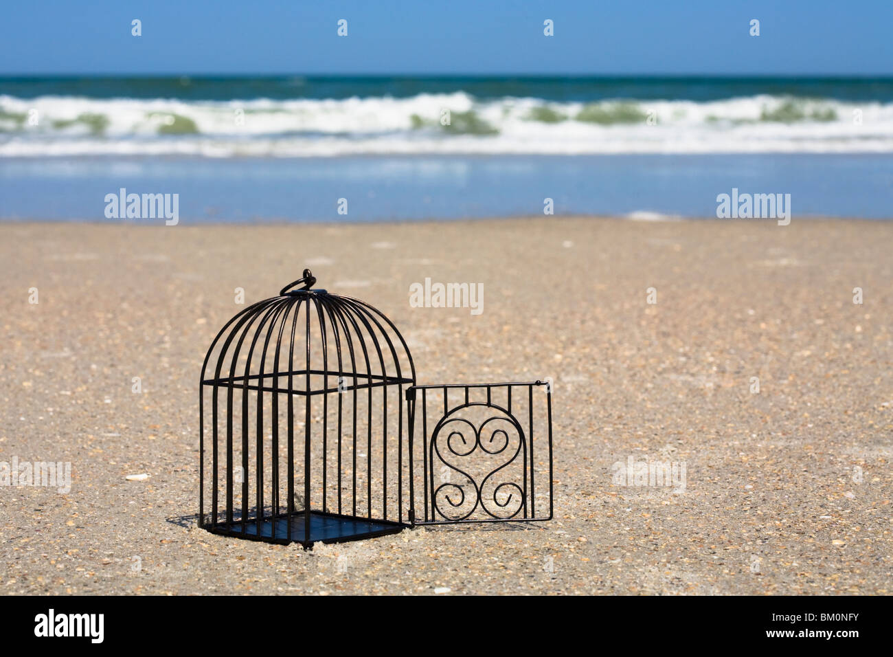 Empty cage on a beach Stock Photo - Alamy