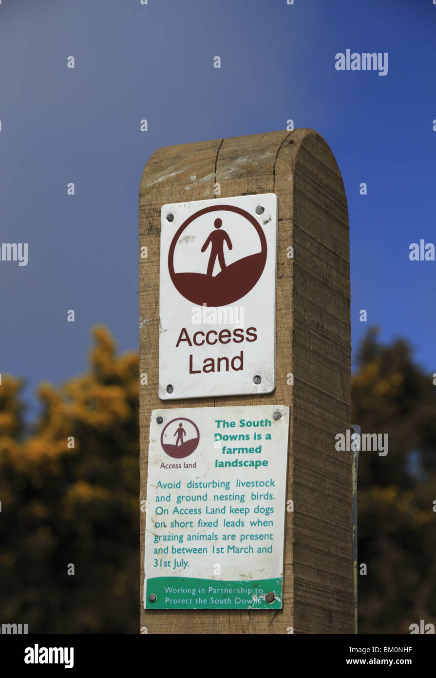 Signs on a way-marker inform people that of open access land on the ...
