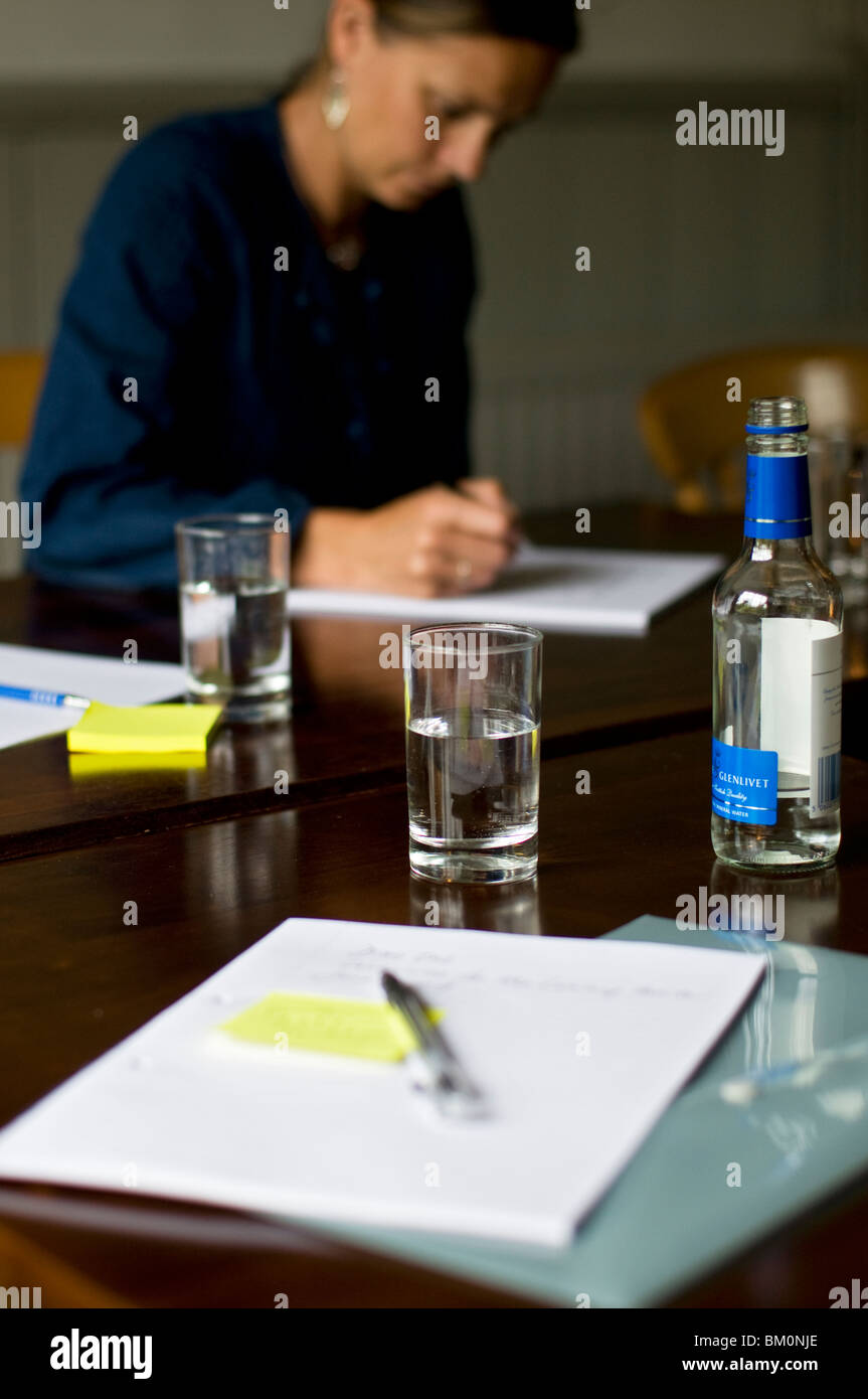woman at conference table, writing Stock Photo - Alamy