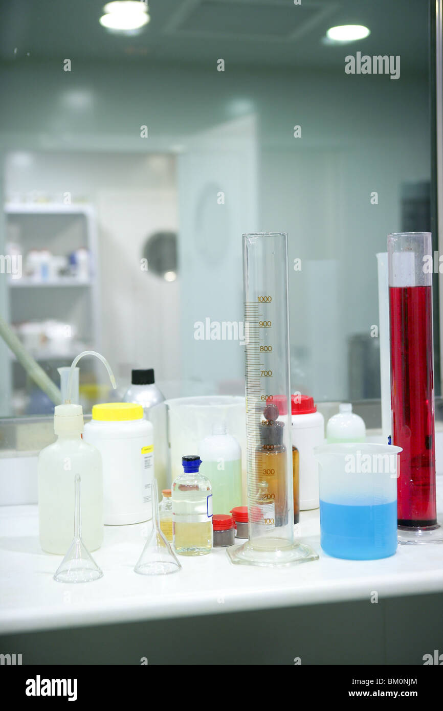 Laboratory stuff, glass cylinder vases, colorful liquids, chemical ...