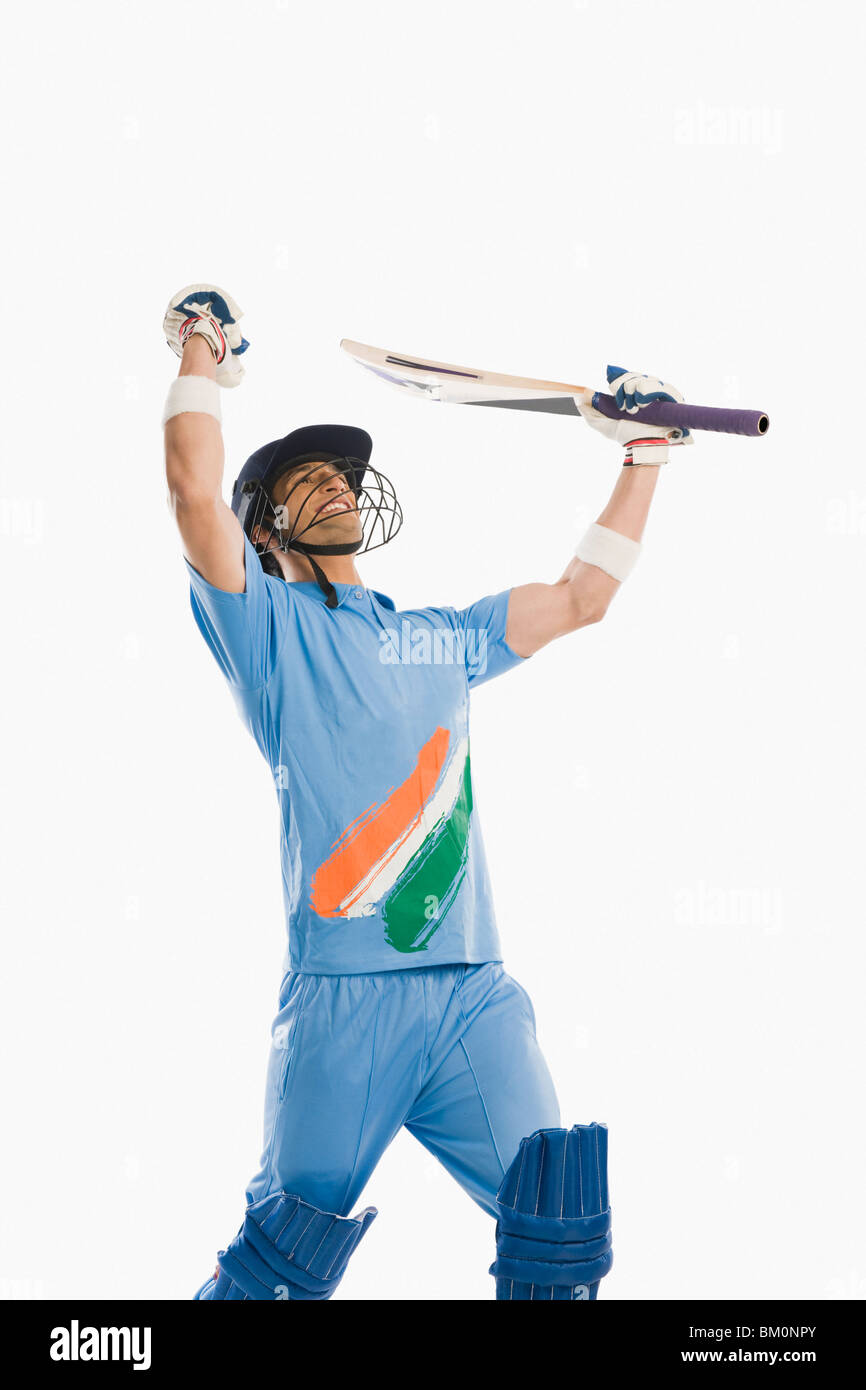Cricket batsman waving his arms in celebration Stock Photo - Alamy