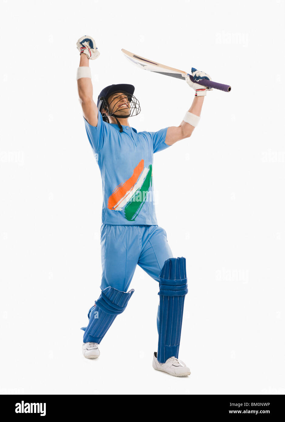 Cricket batsman waving his arms in celebration Stock Photo - Alamy