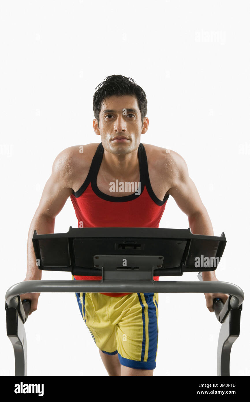Man running on a treadmill Stock Photo - Alamy