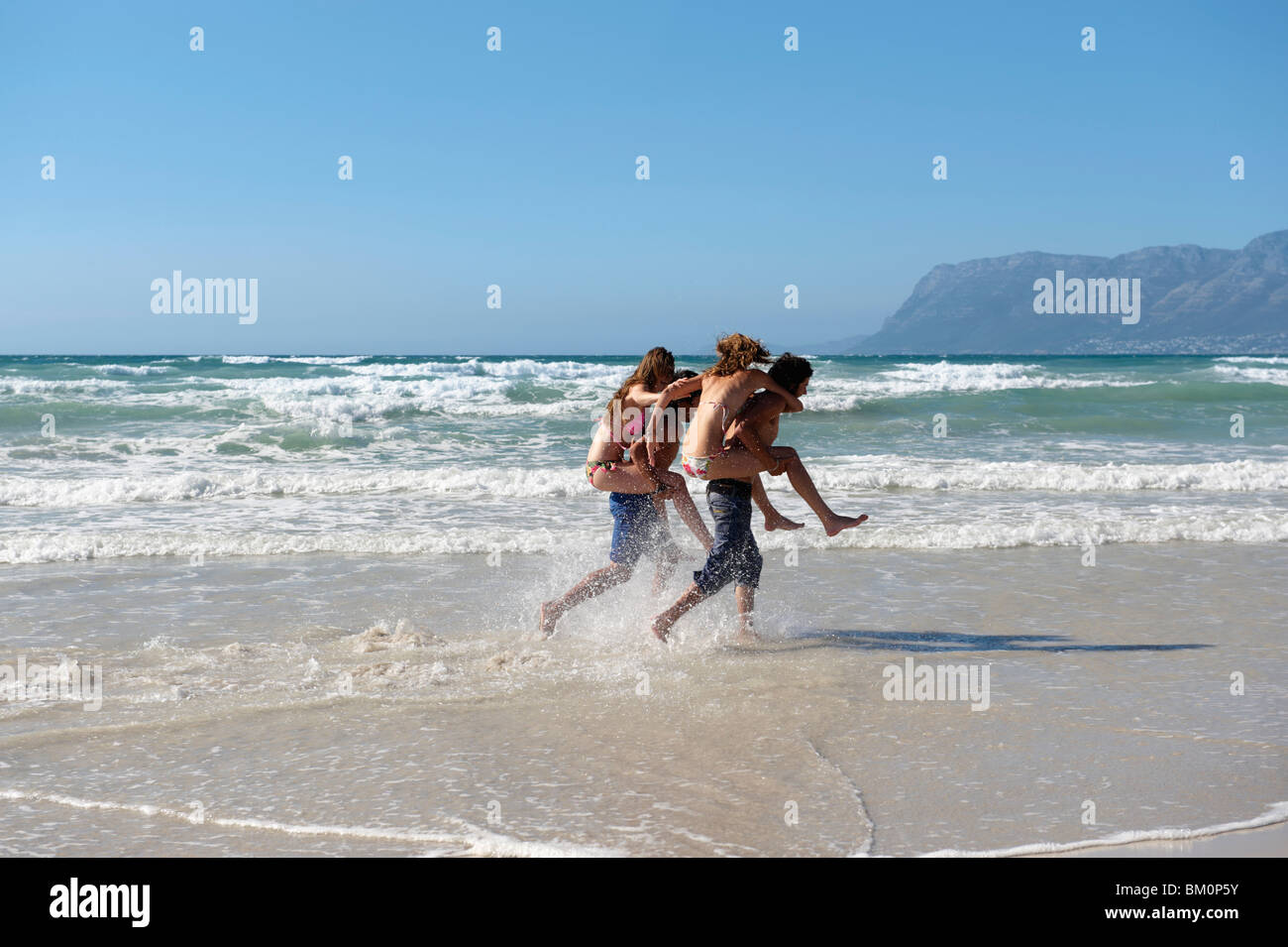 Couple piggyback racing Stock Photo - Alamy