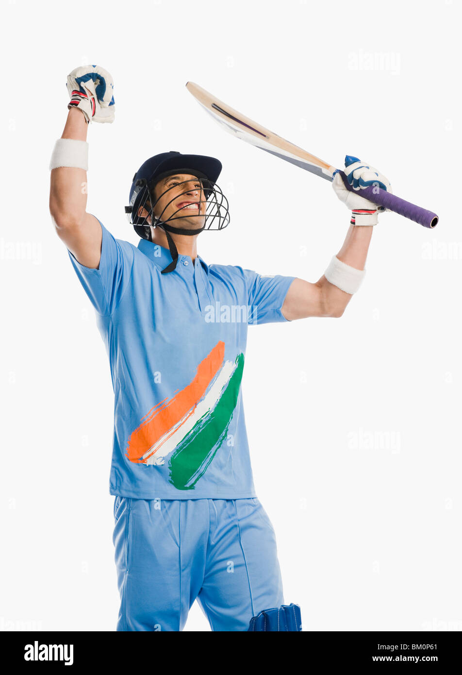 Cricket batsman waving his arms in celebration Stock Photo - Alamy