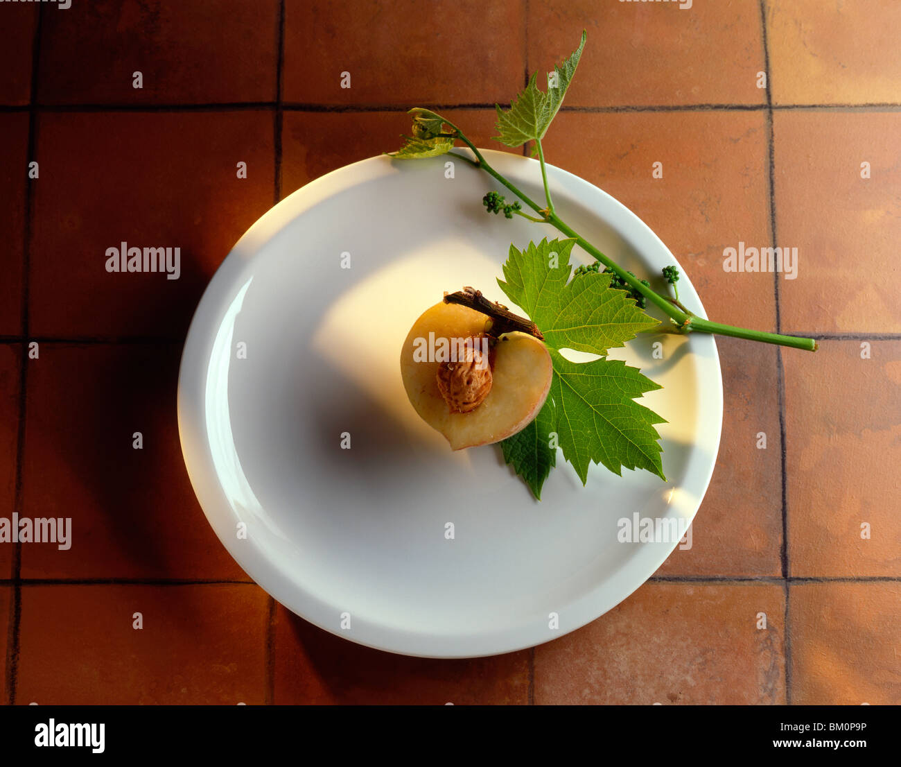 white fleshed peach half Stock Photo - Alamy