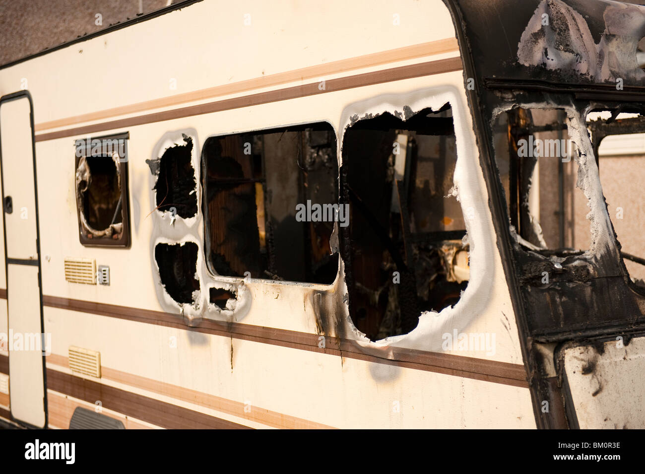 Burnt out Dethleffs touring caravan following arson fire Stock Photo ...