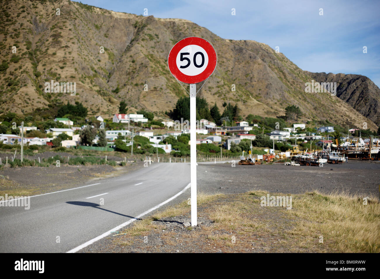 A fifty kilometre per hour speed limit sign at Ngawi in New Zealand ...