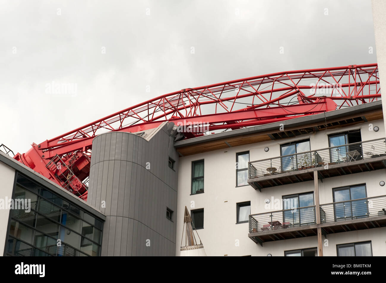 Tower crane collapsed onto roof of apartment block Stock Photo - Alamy