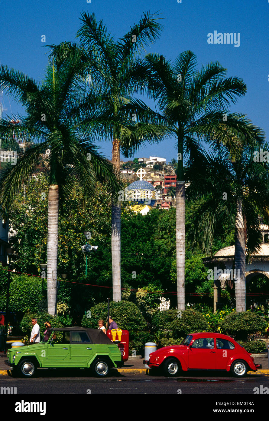 Cars parked in front of palm trees, Zocalo, Acapulco, Guerrero, Mexico ...