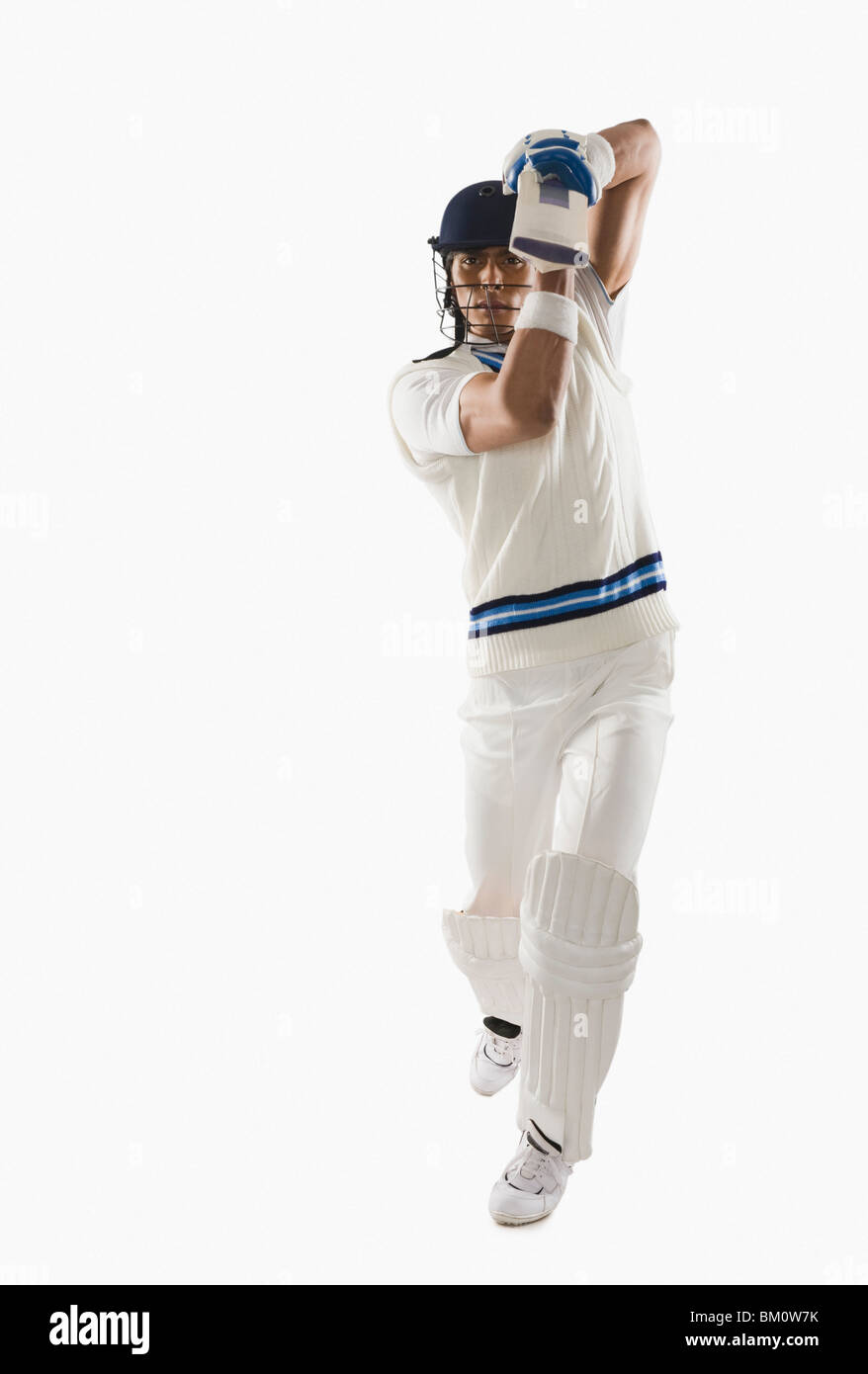 Cricket batsman playing a straight drive shot Stock Photo - Alamy