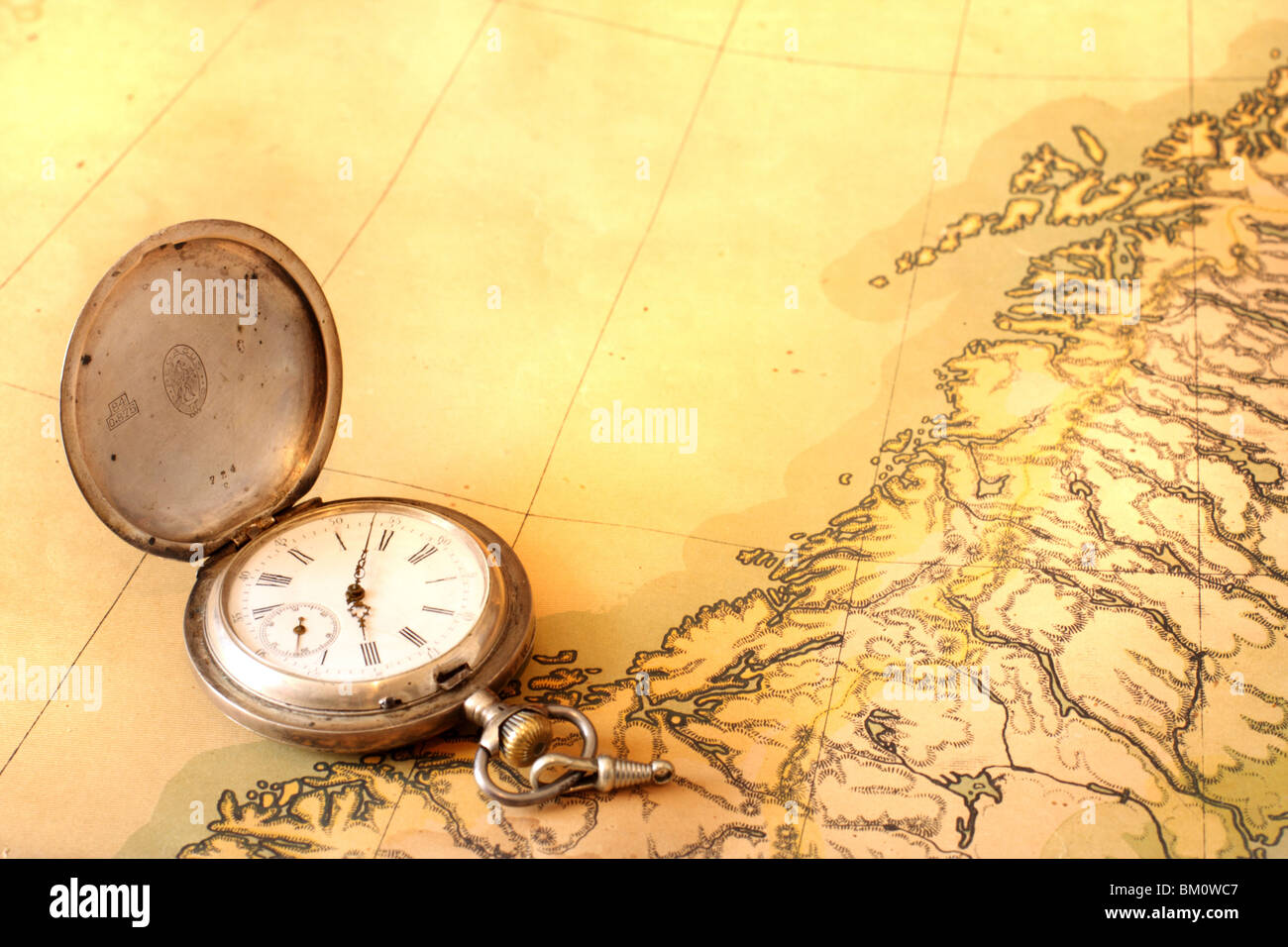 Ancient map with old silver pocket watch Stock Photo - Alamy
