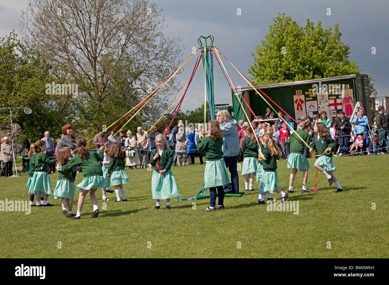 Woodmancote school children dancing around maypole on Mayday at ...