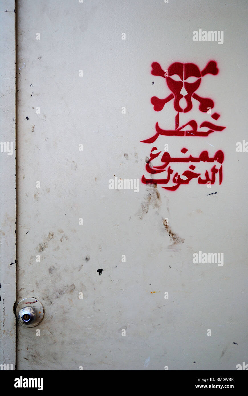 A warning sign with skull and crossbones posted on door, Hurghada ...