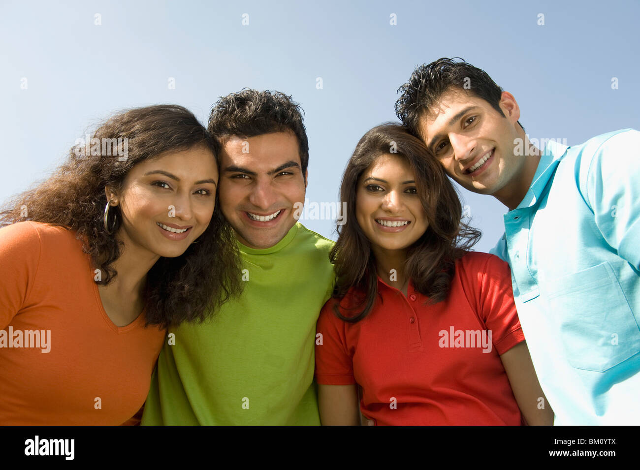 Portrait of four friends smiling Stock Photo - Alamy
