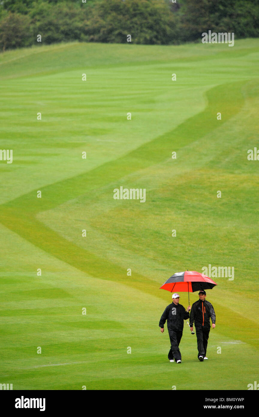 Golfer with umbrella in rain hi-res stock photography and images - Alamy