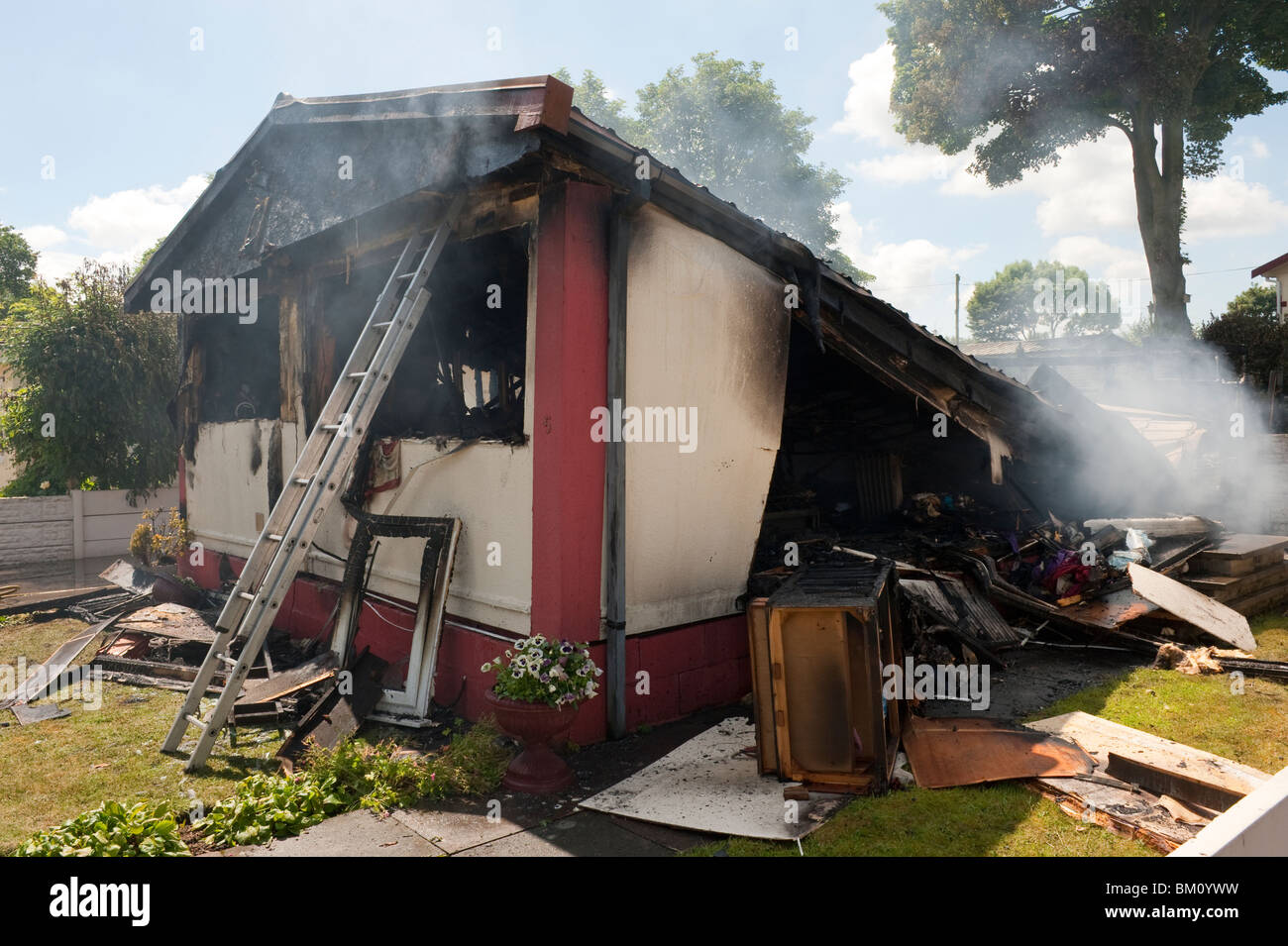 Mobile home on fire following gas explosion Stock Photo - Alamy
