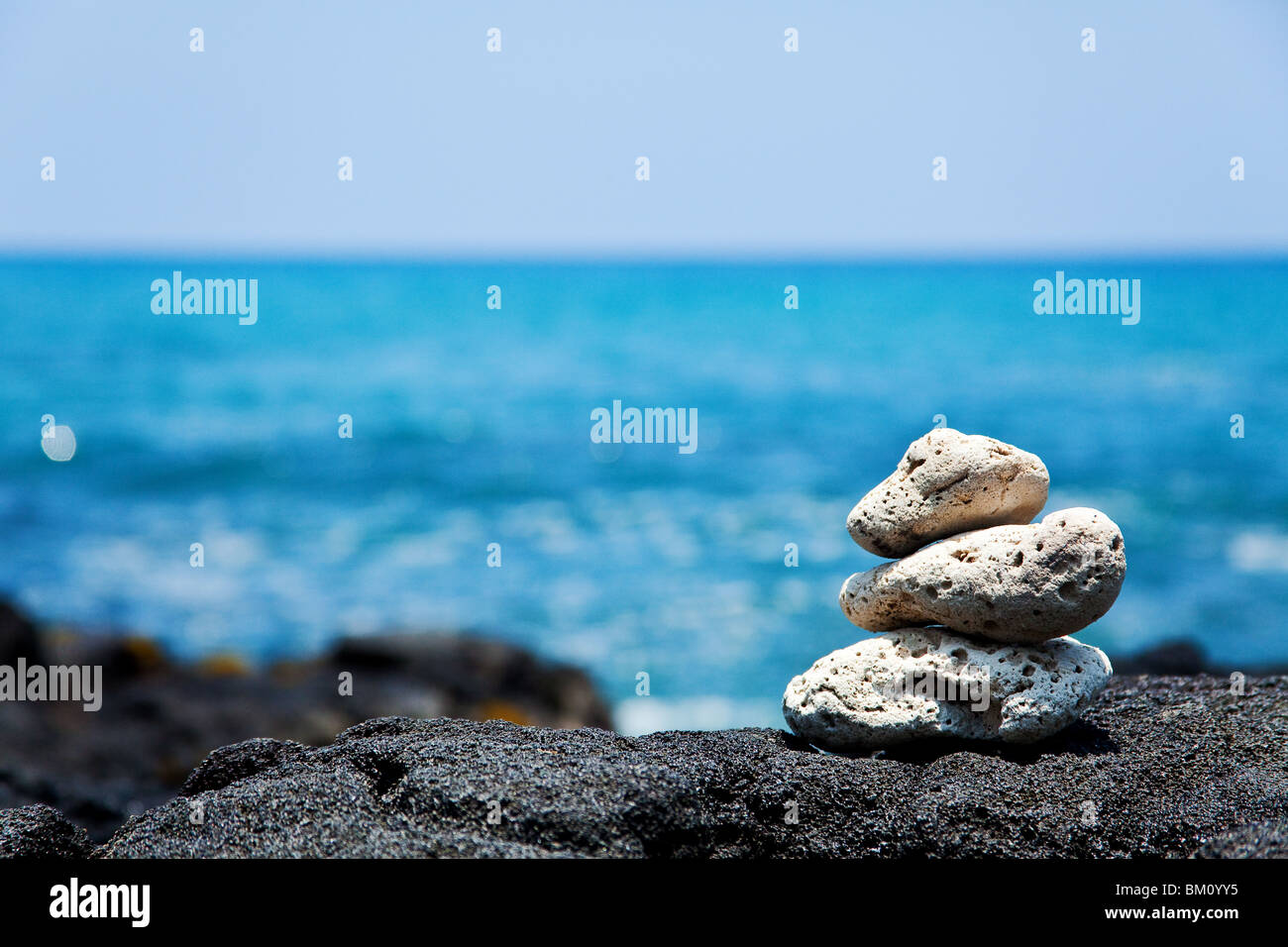 White Zen rocks on Hawaiian coastline with lava Stock Photo - Alamy