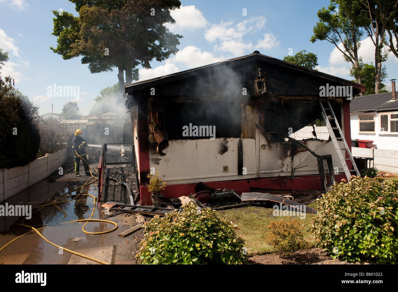 Mobile home on fire following gas explosion Stock Photo - Alamy