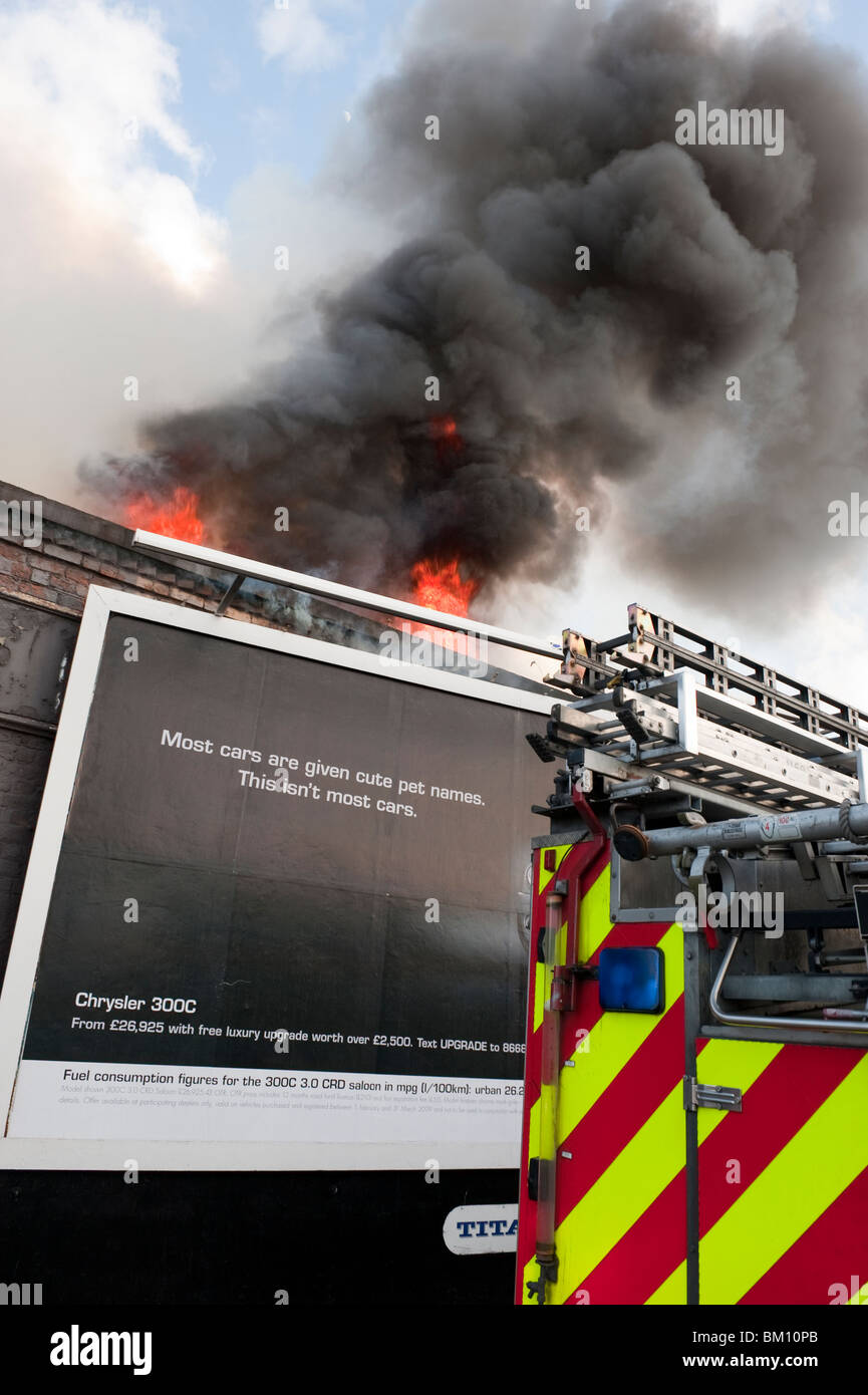 Advertising Billboard on fire with flames & smoke Stock Photo - Alamy