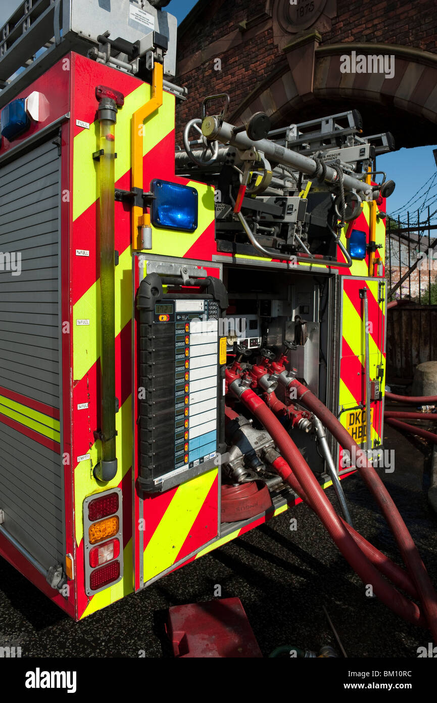 Fire engine rear pump locker with hose attached Stock Photo - Alamy