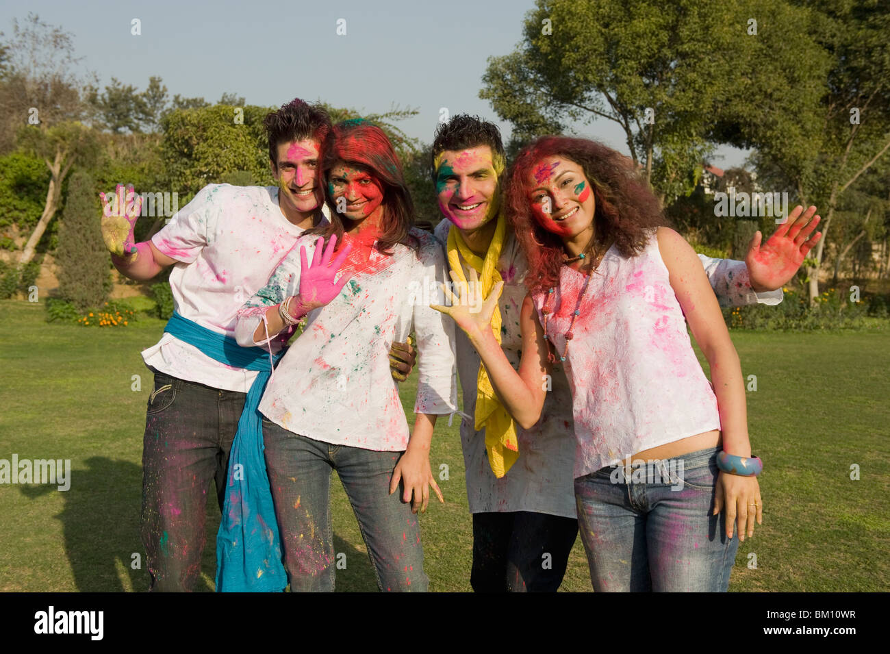 Friends celebrating Holi Stock Photo - Alamy