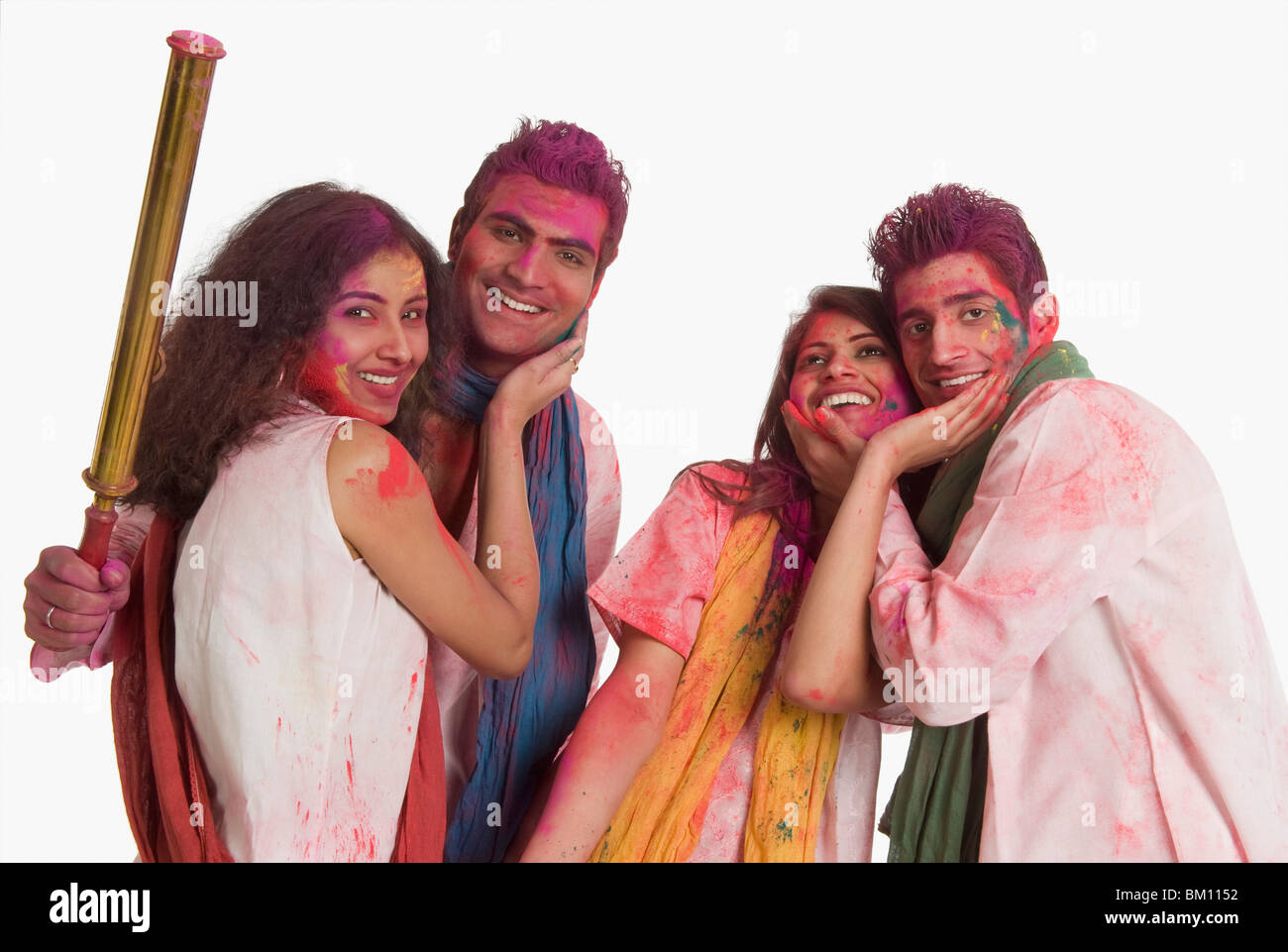 Friends celebrating Holi Stock Photo - Alamy