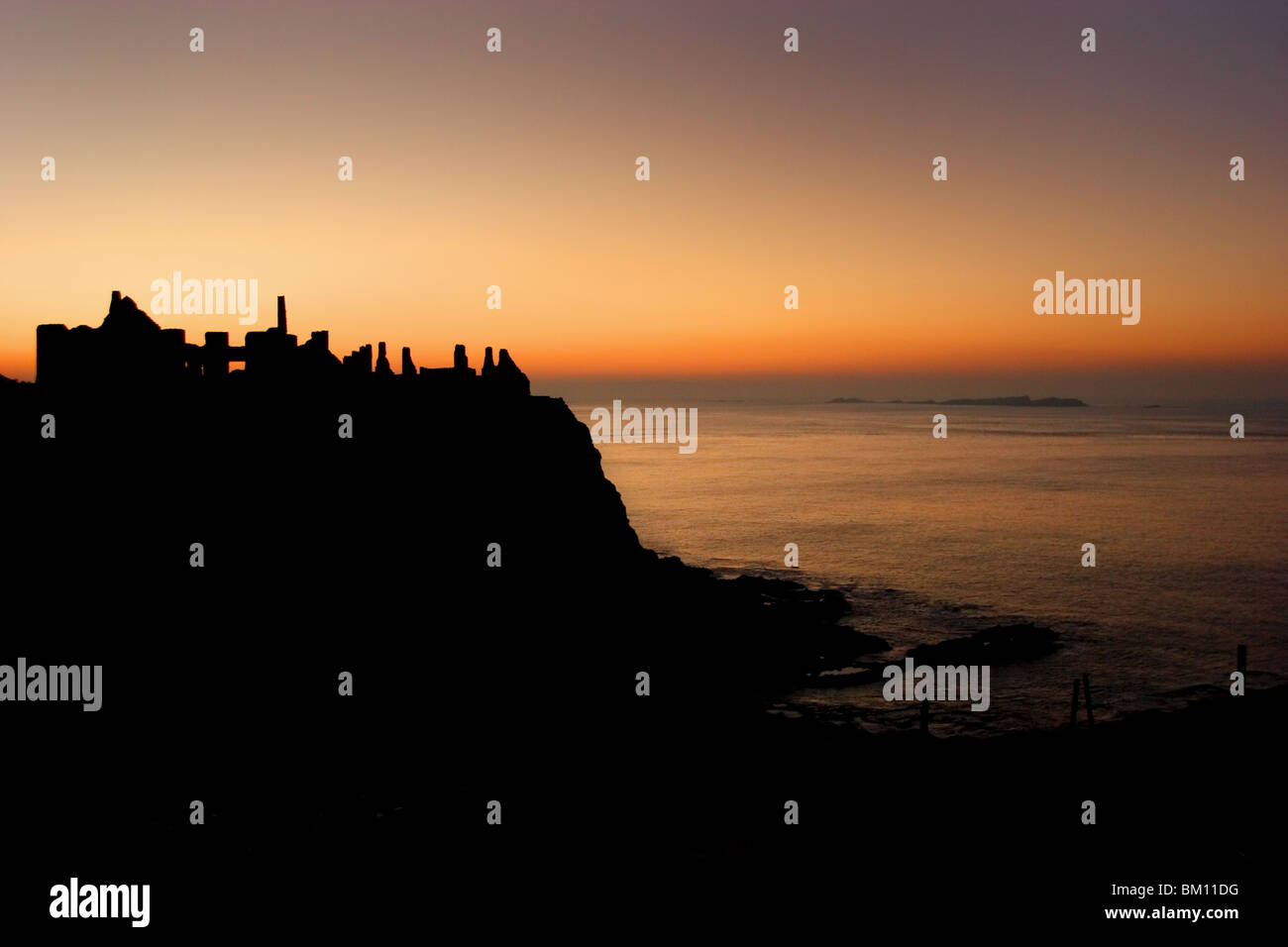 Dunluce Castle and the skerries after sunset, Causeway Coast, Northern ...