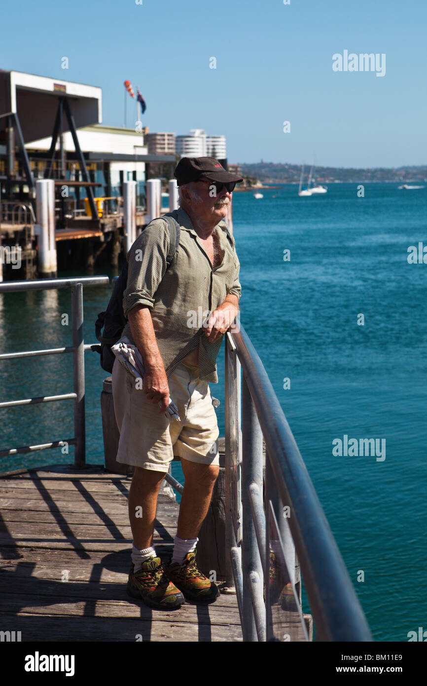 A man looking across the water Stock Photo - Alamy