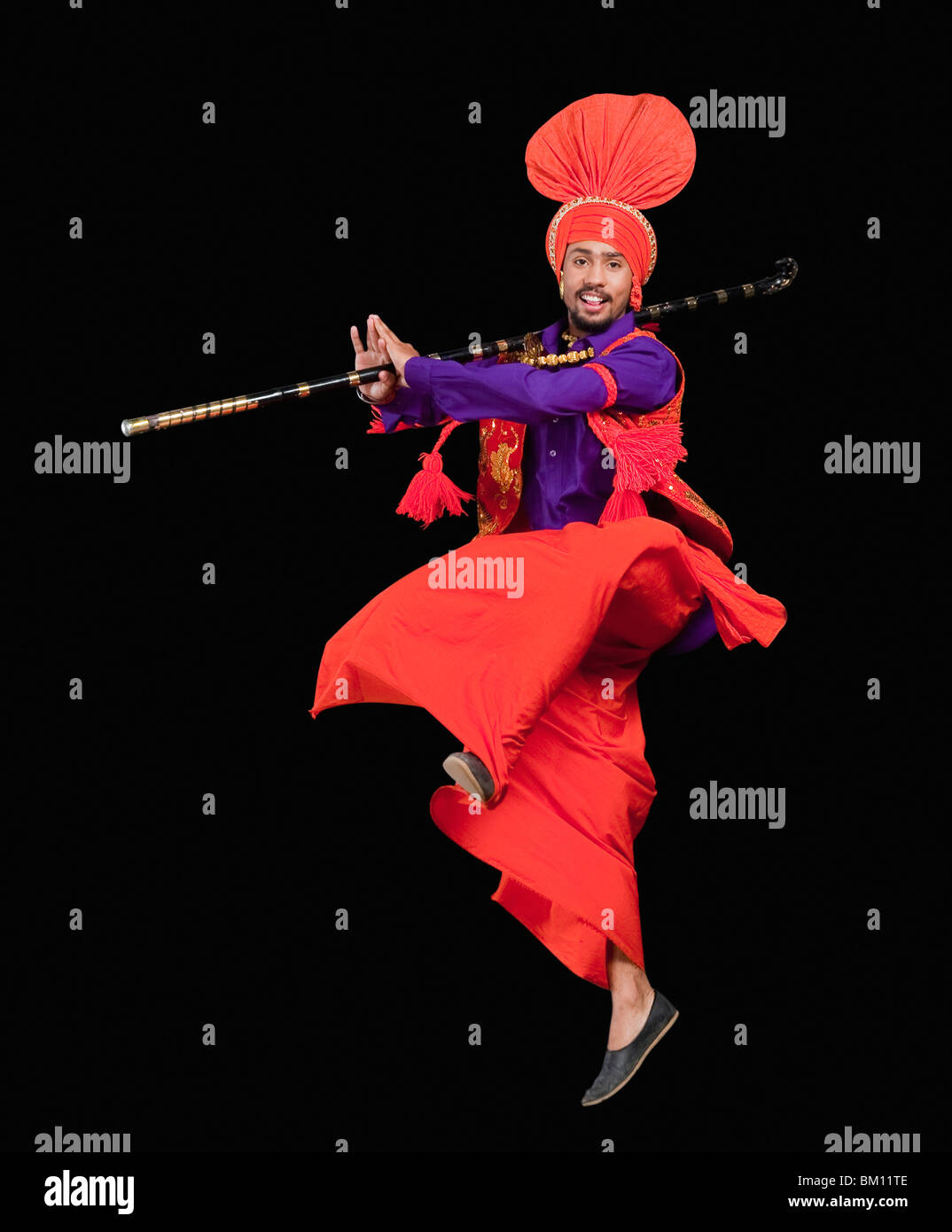 Bhangra dancer holding stick in hi-res stock photography and images - Alamy
