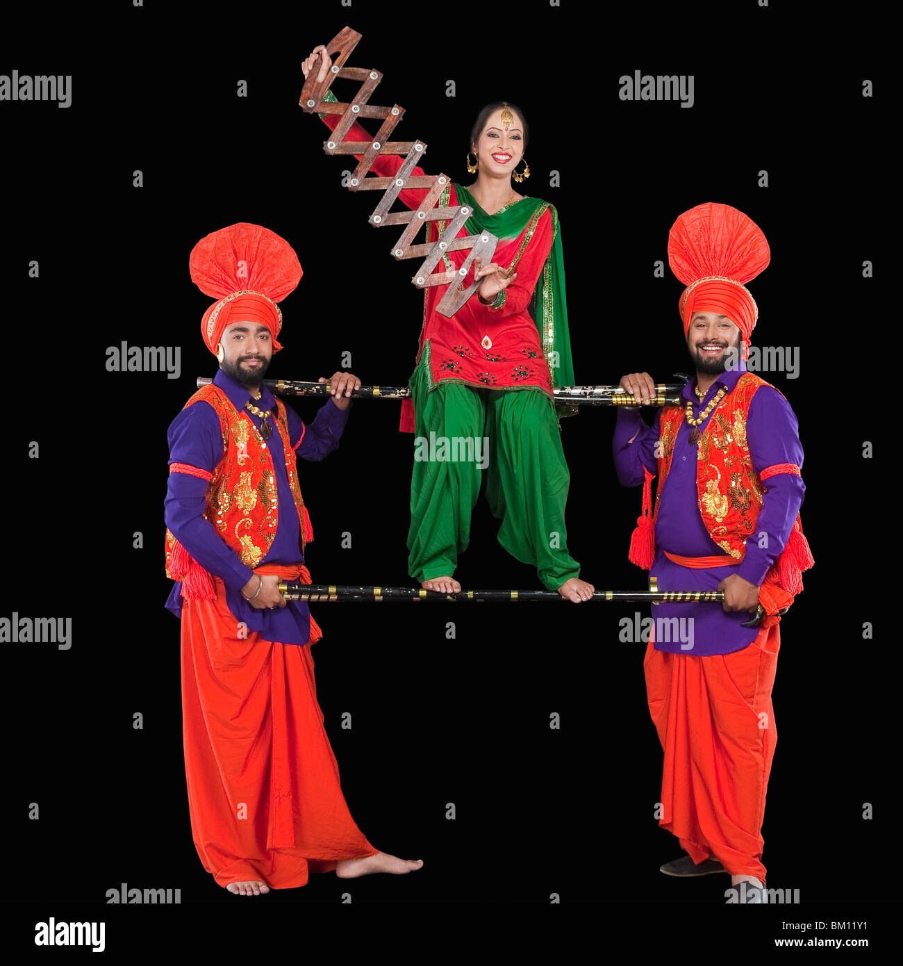 Bhangra dancer holding stick in hi-res stock photography and images - Alamy