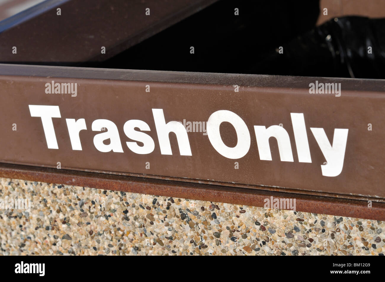 Trash barrel labelled trash only Stock Photo - Alamy