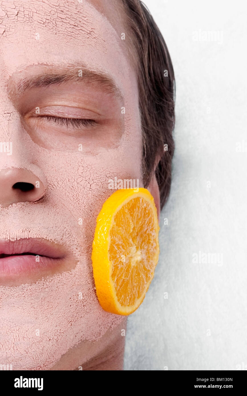 Orange slices on a man's face Stock Photo - Alamy